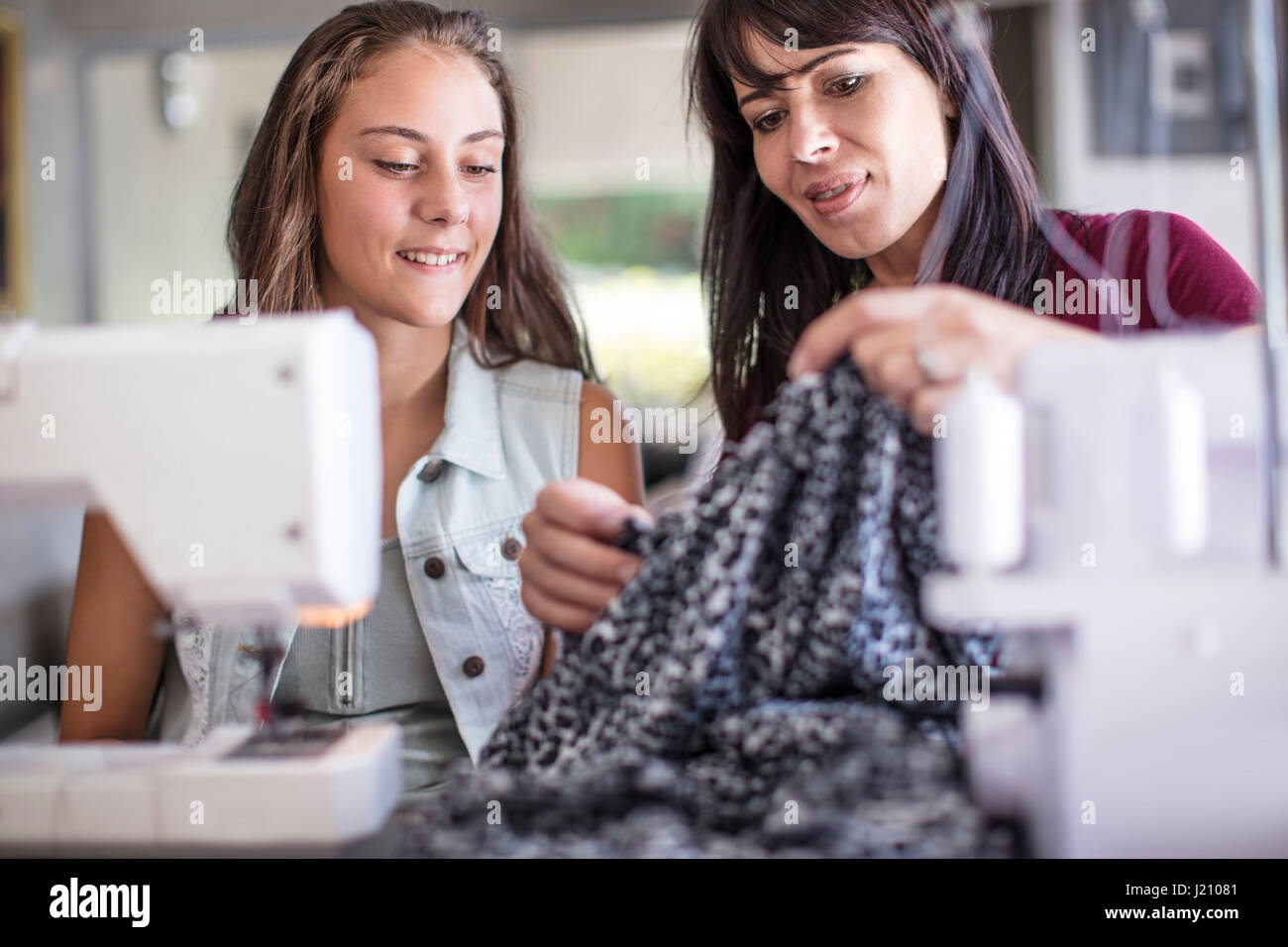 Mother and daughter sewing together Stock Photo - Alamy