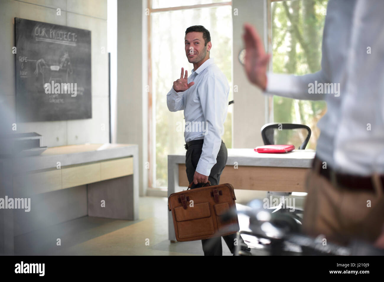 Colleagues saying good bye after a meeting Stock Photo - Alamy