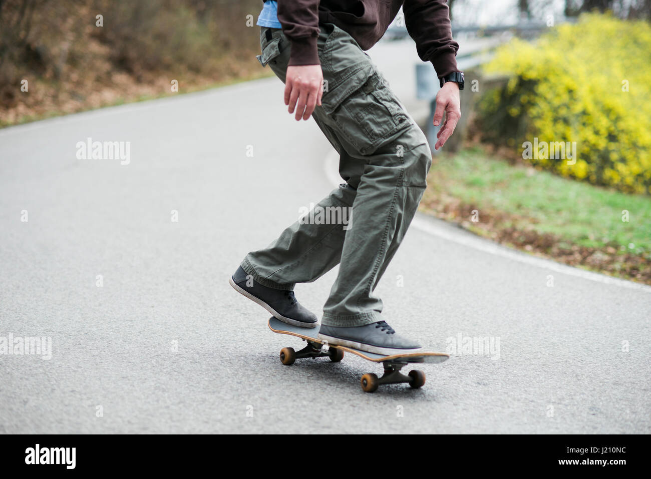 Man skating down the road Stock Photo - Alamy