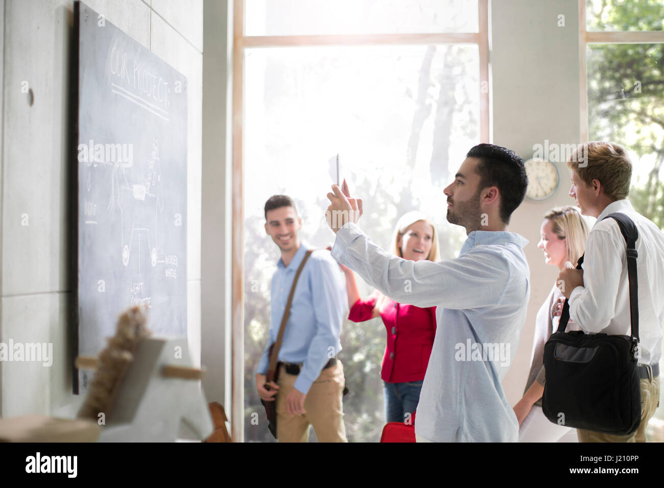 Business people having a presentation of product design Stock Photo - Alamy