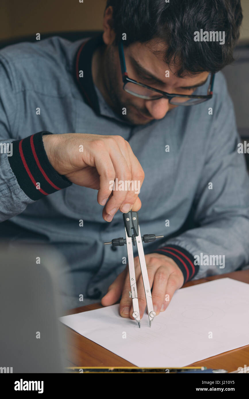 Man using compasses hi-res stock photography and images - Alamy