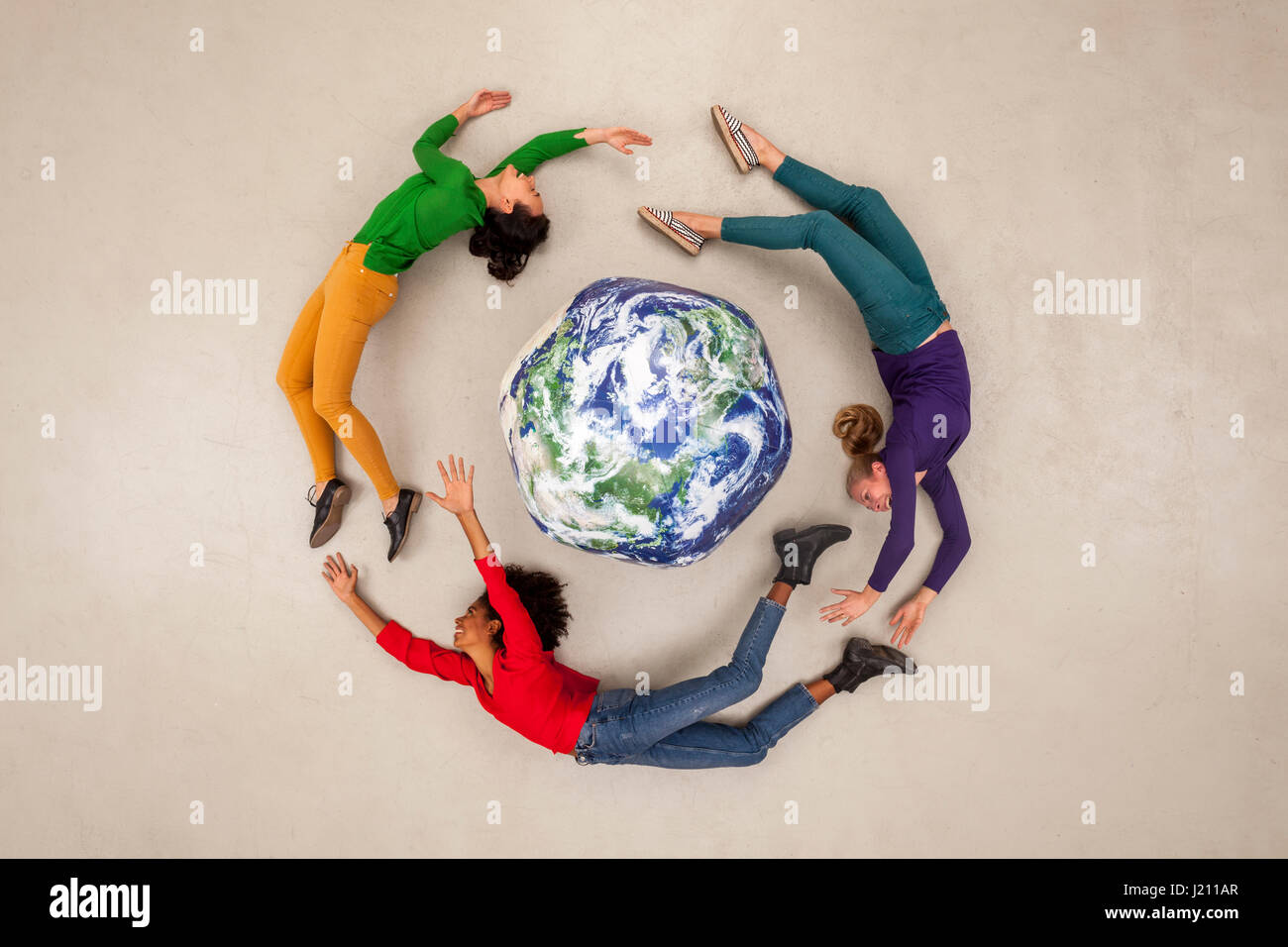 Three women flying aroung the world Stock Photo - Alamy
