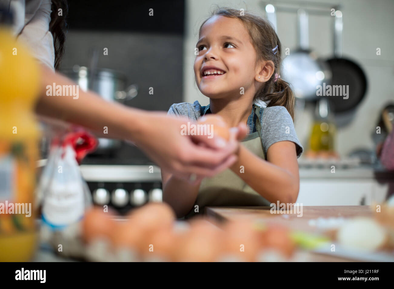 Family cooking together in kitchen Stock Photo - Alamy