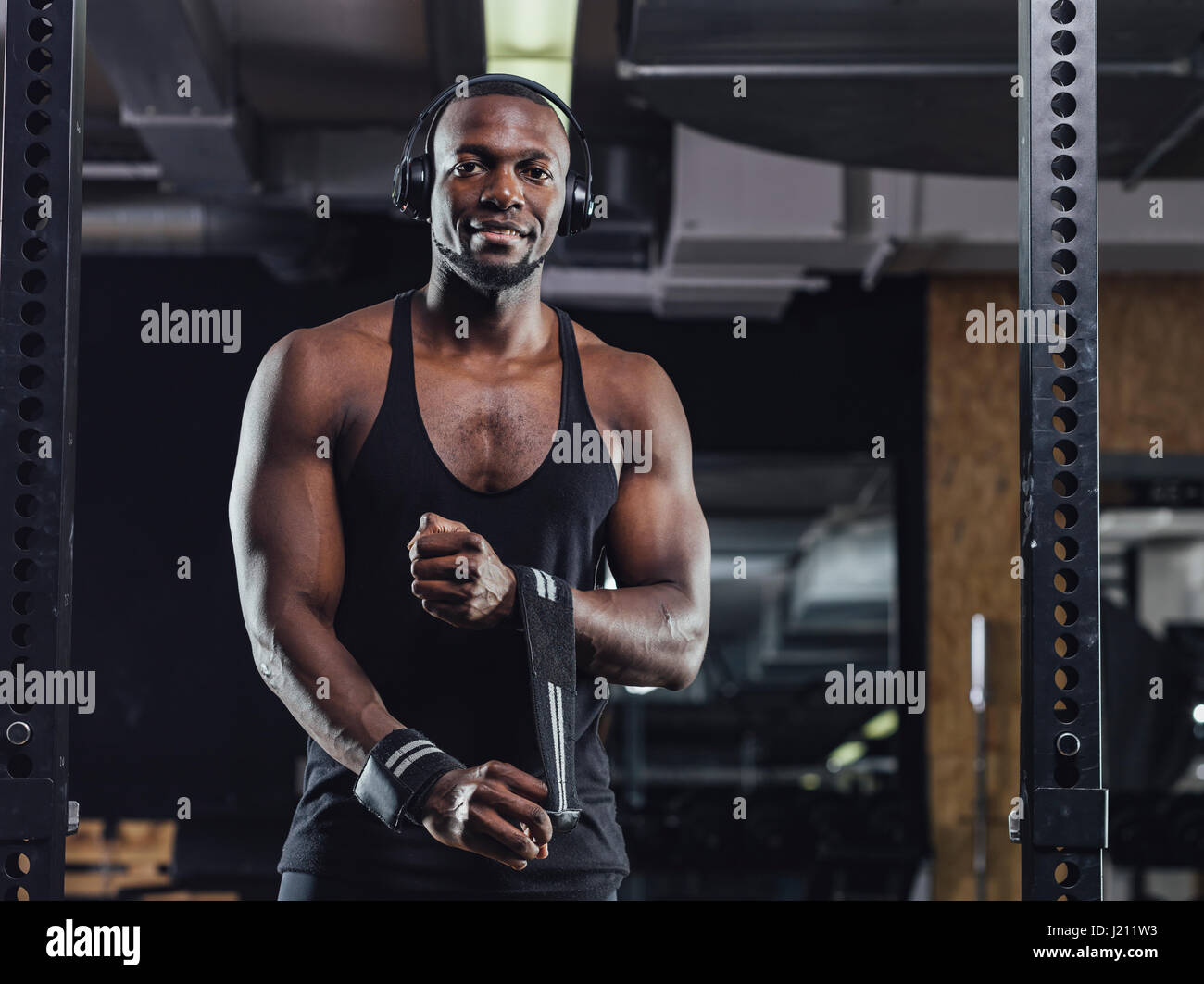 Athlete standing in gym, preparing for training Stock Photo - Alamy