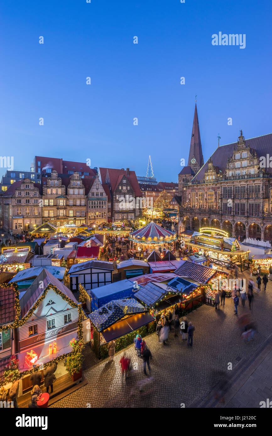 Germany, Bremen, Christmas market on market square in the evening seen ...