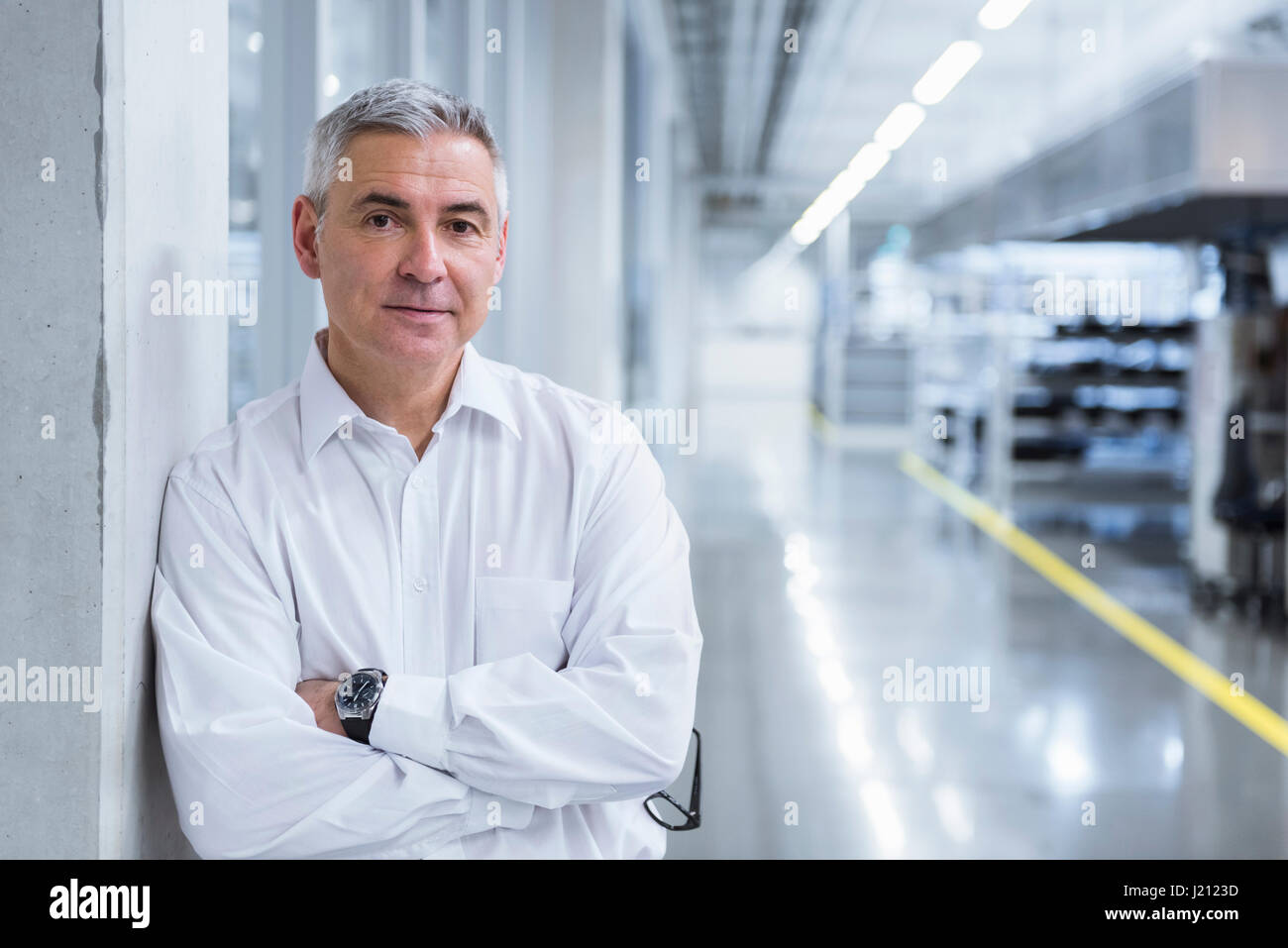 Portrait of a manager on shop floor of a factory Stock Photo - Alamy