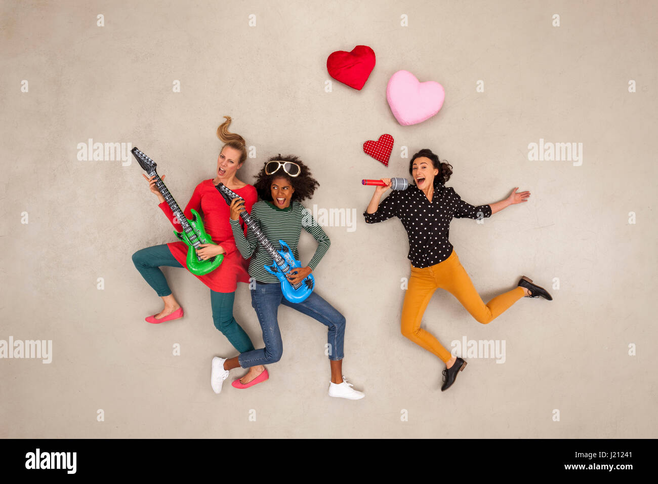 Friends playing music in a rock band Stock Photo - Alamy