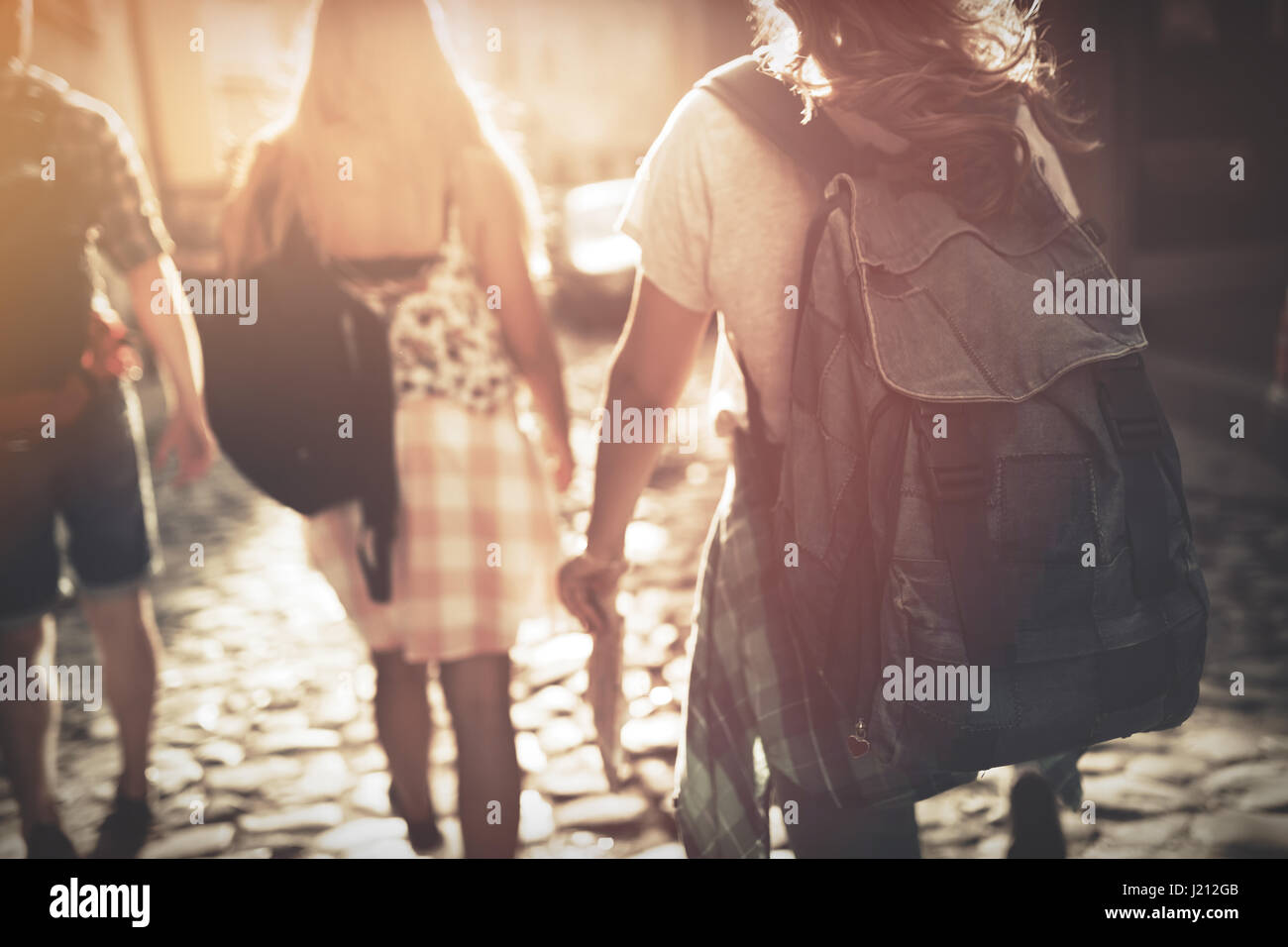 Tourist group of friends discovering city on foot and travelling Stock ...