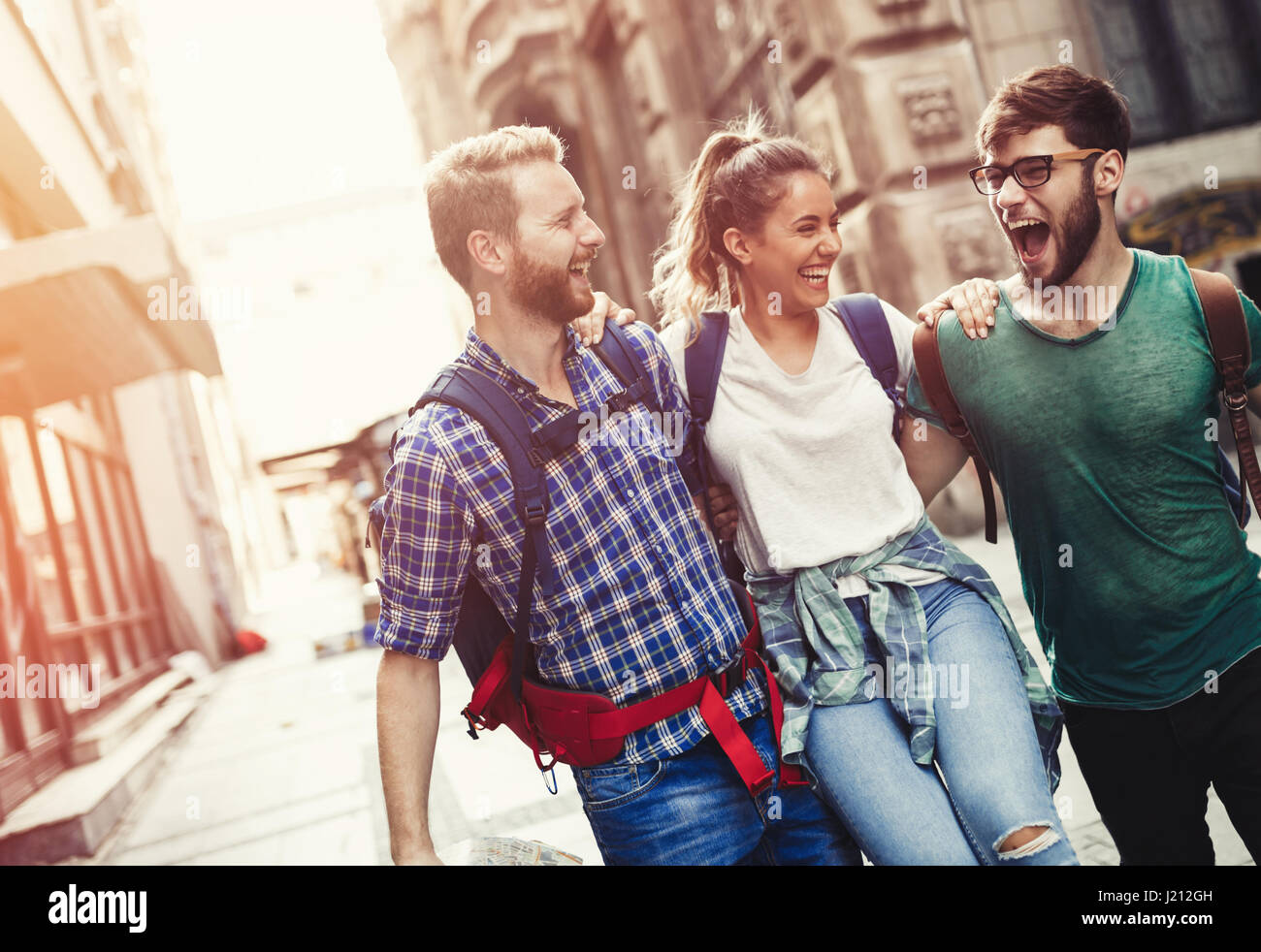 Happy group of tourists traveling and sightseeing together Stock Photo ...