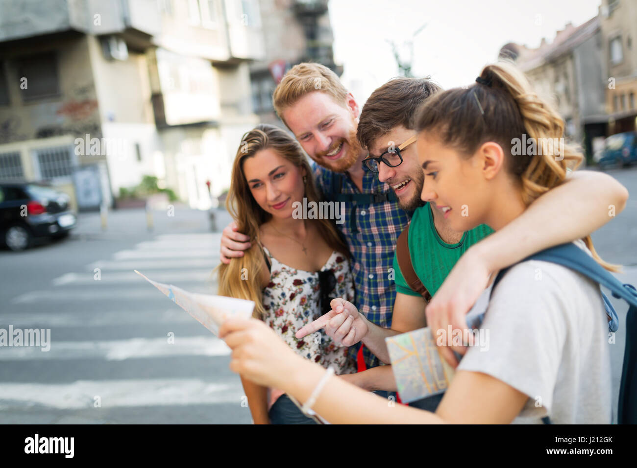 Tourist group of friends discovering city on foot and travelling Stock ...