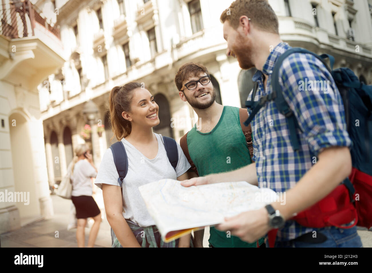 Happy group of tourists traveling and sightseeing together Stock Photo ...