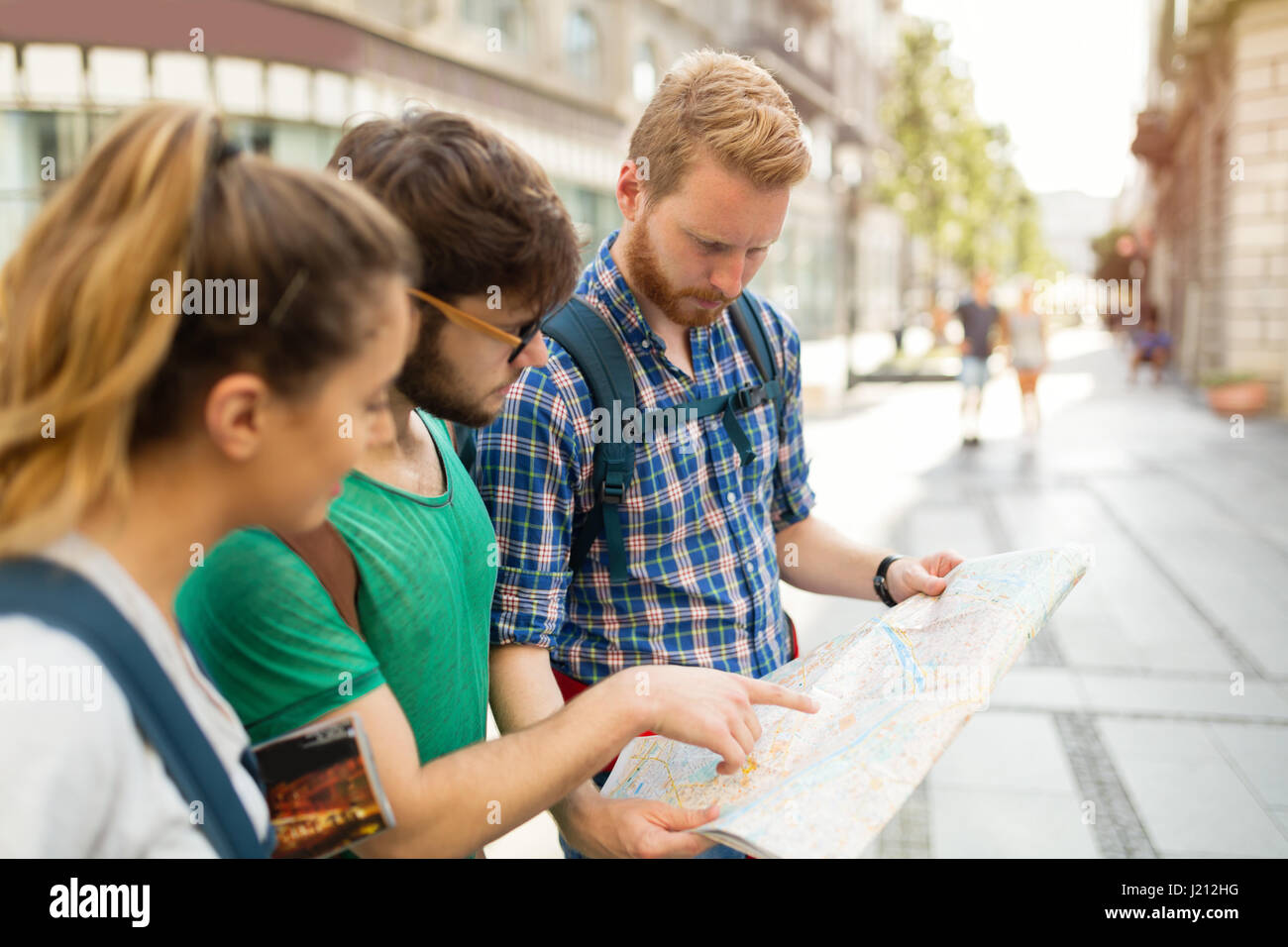 Happy group of students on sightseeing and travel adventure Stock Photo ...