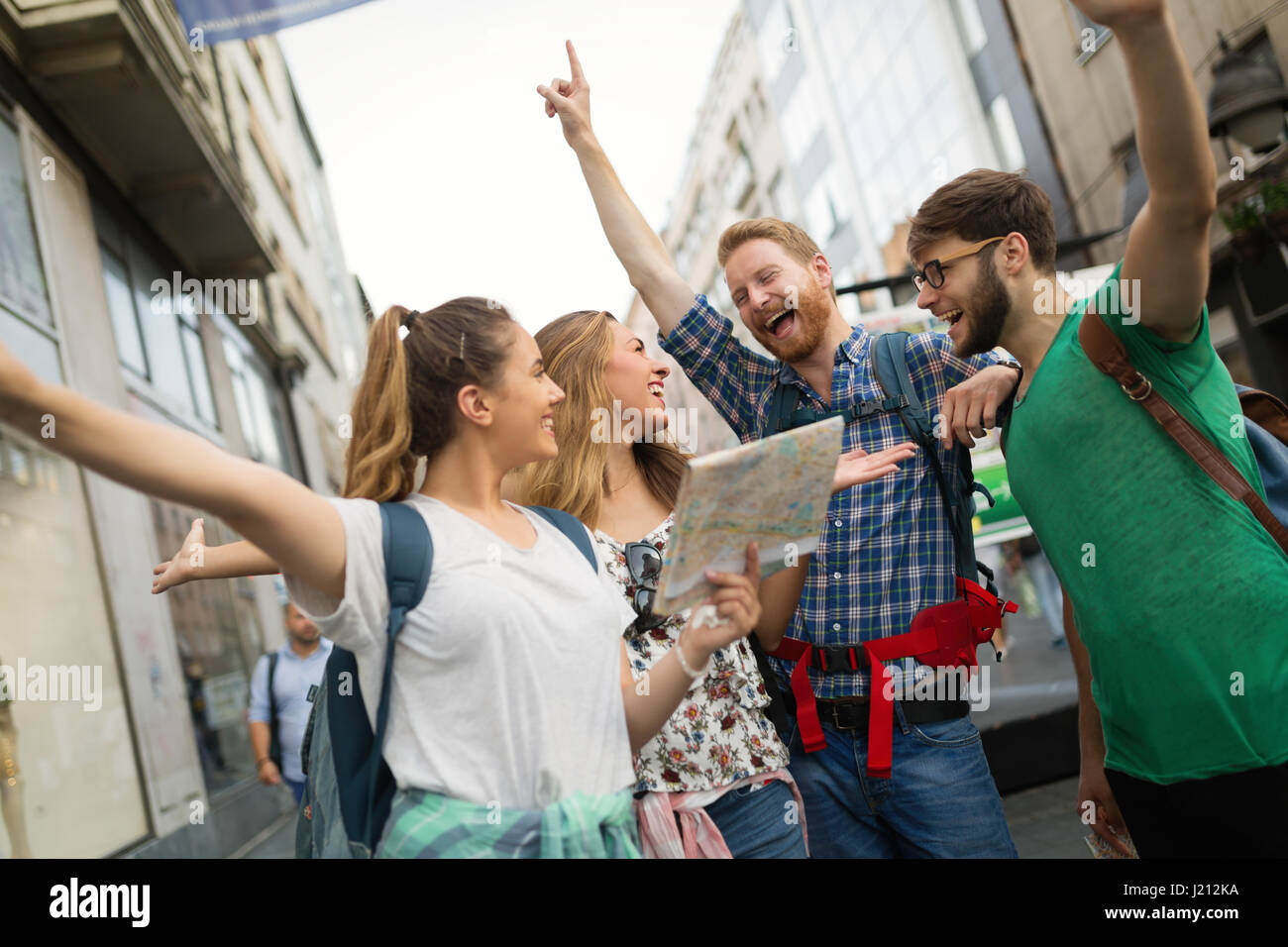 Happy group of tourists traveling and sightseeing together Stock Photo ...
