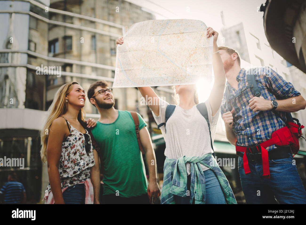 Happy group of tourists traveling and sightseeing together Stock Photo ...