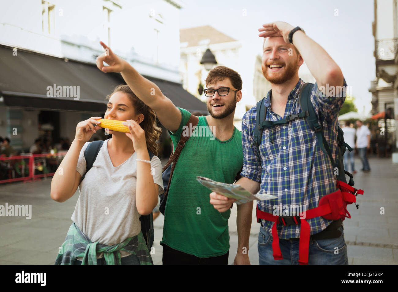 Happy group of tourists traveling and sightseeing together Stock Photo ...