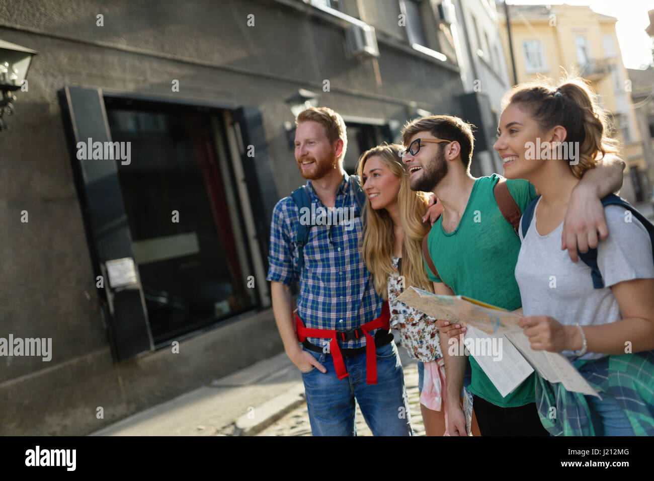 Happy group of tourists traveling and sightseeing together Stock Photo ...
