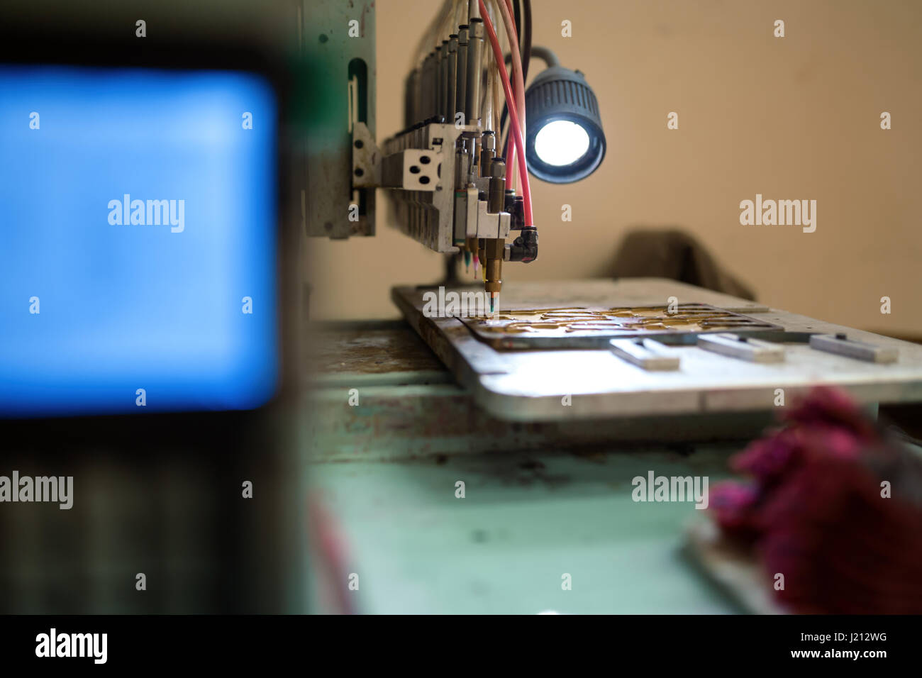 Automatic programmable pattern painting machine Stock Photo - Alamy