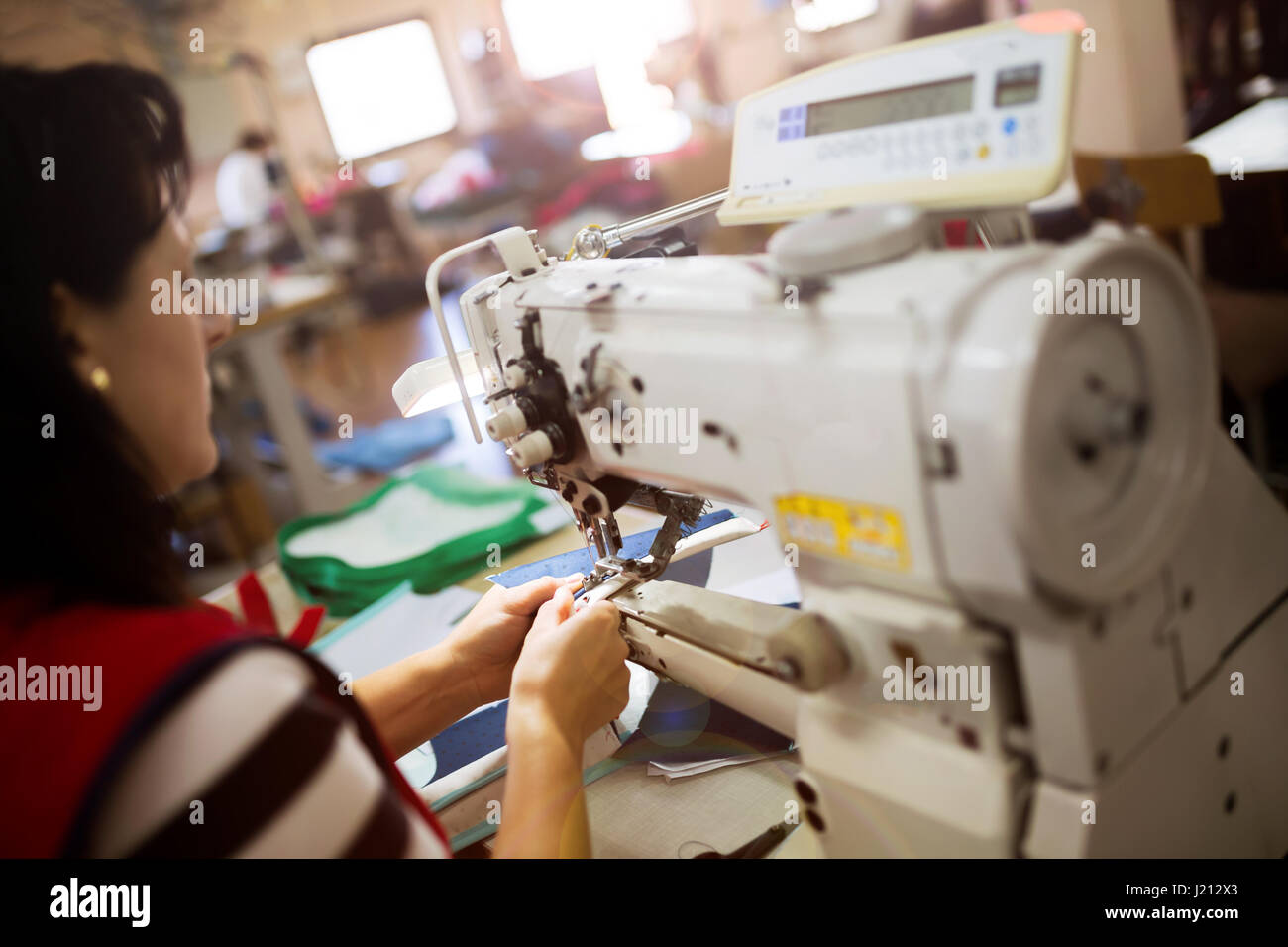 Happy sewing factory worker hi-res stock photography and images - Alamy