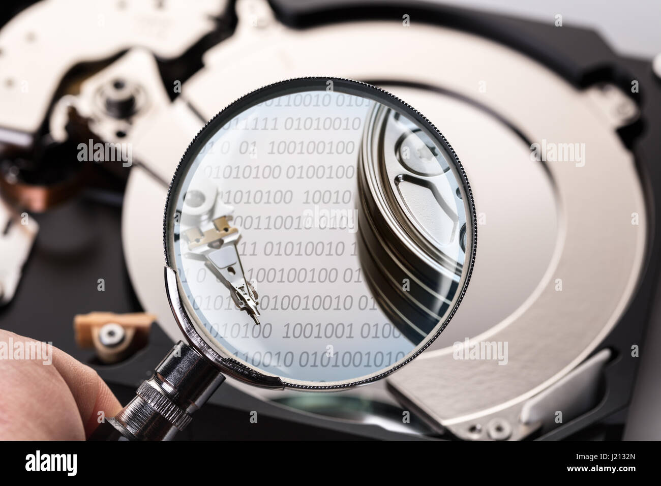Disassembled computer hard disk and magnifier close-up Stock Photo - Alamy