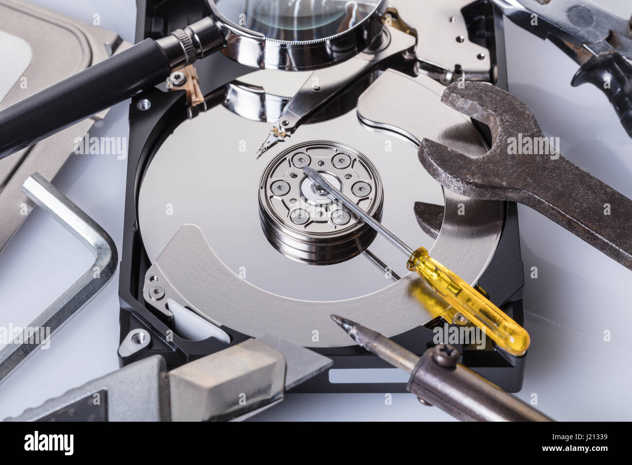 Disassembled computer hard disk and tools close-up Stock Photo - Alamy