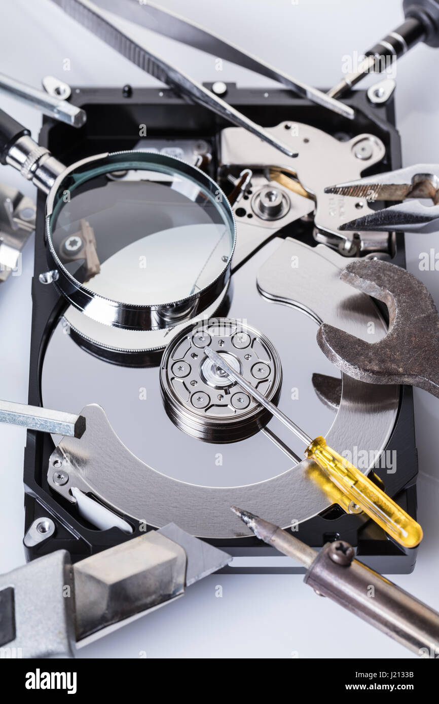 Disassembled computer hard disk and tools close-up Stock Photo - Alamy