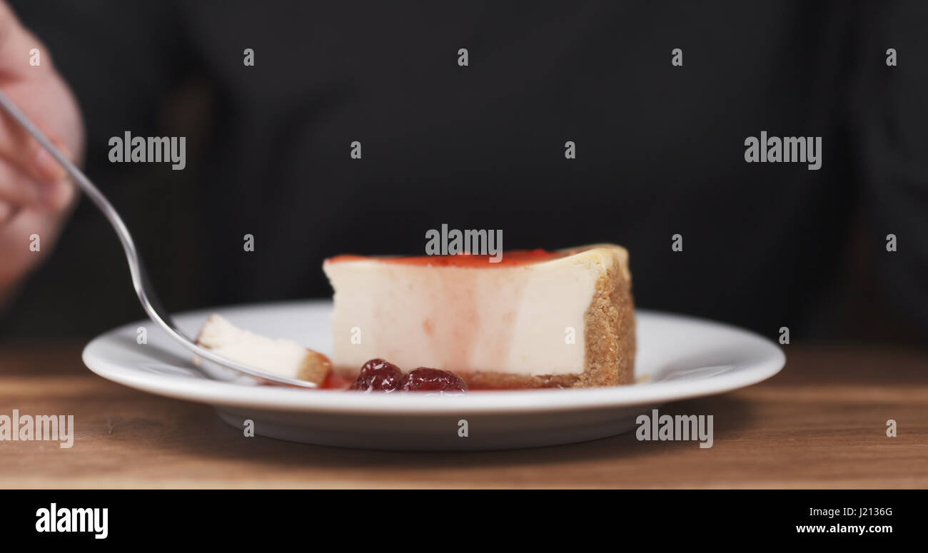 teenage girl eating cheesecake with strawberry jam, 4k photo Stock ...