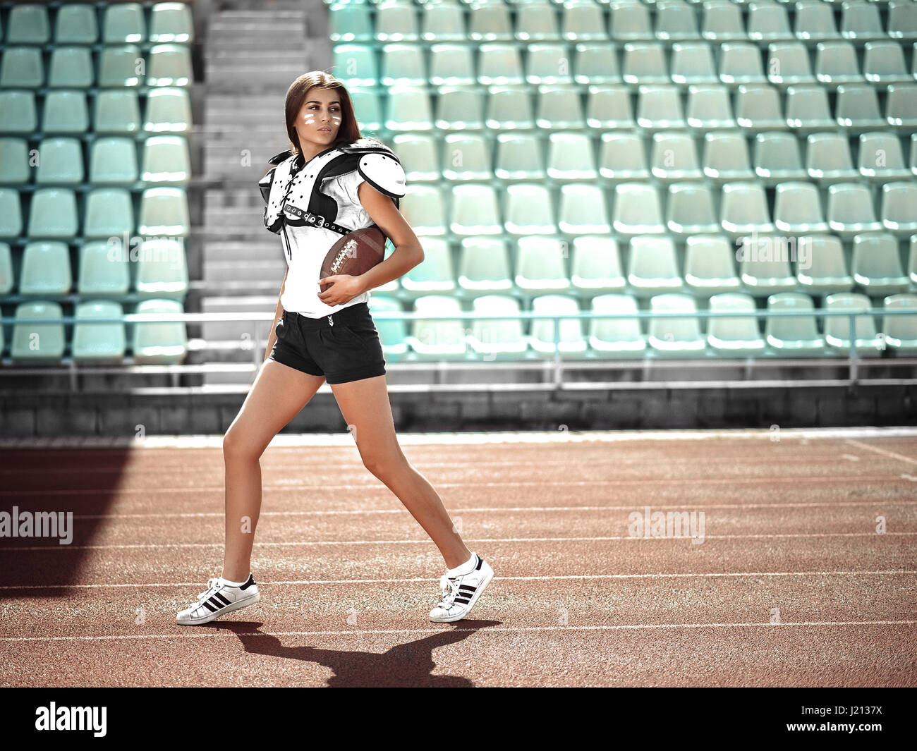 Rugby girl player run with ball Stock Photo - Alamy