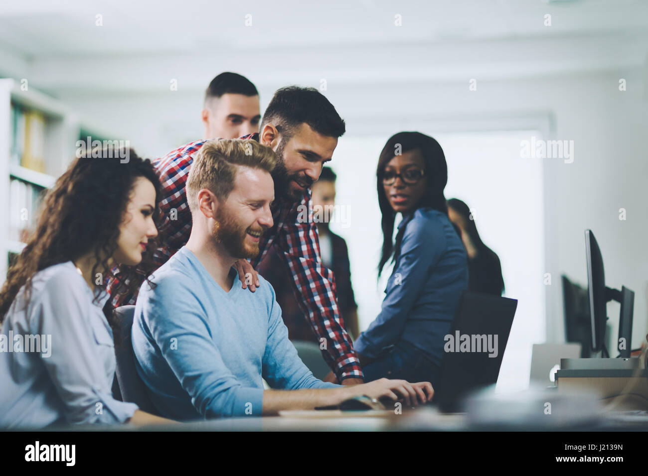 Programmer working in a software developing company office Stock Photo - Alamy