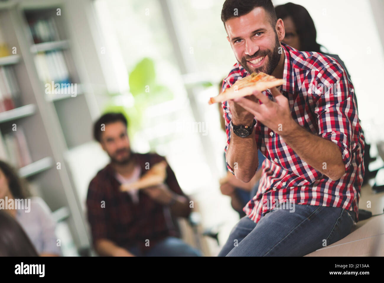 Colleagues corporate lunch break at work in company offices Stock Photo ...