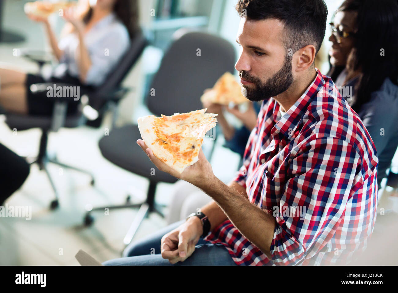 Colleagues corporate lunch break at work in company offices Stock Photo ...