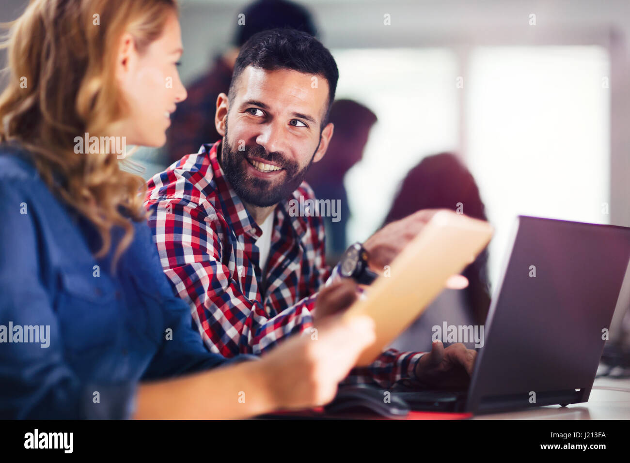 Programmer working in a software developing company office Stock Photo - Alamy