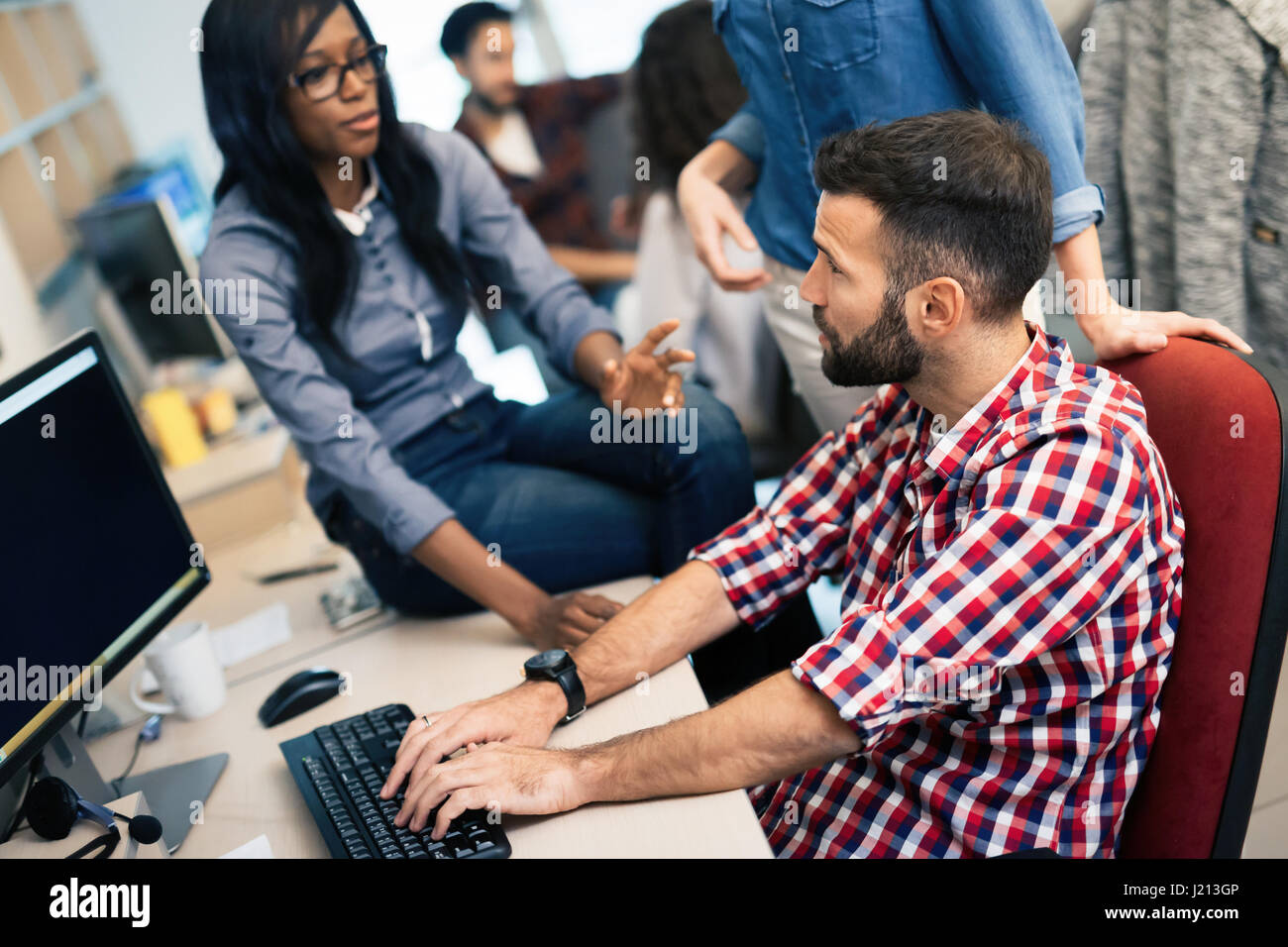 Programmer working in a software developing company office Stock Photo - Alamy