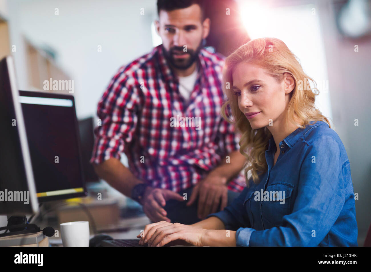 Programmer working in a software developing company office Stock Photo - Alamy