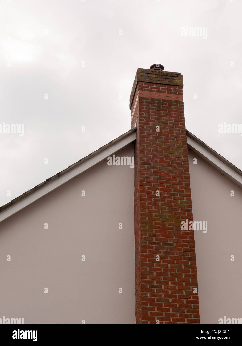 a large chimney on the side of a house with a sky background and white ...