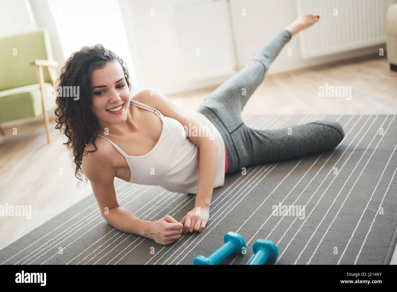Beautiful woman practicing and working out to stay fit Stock Photo - Alamy