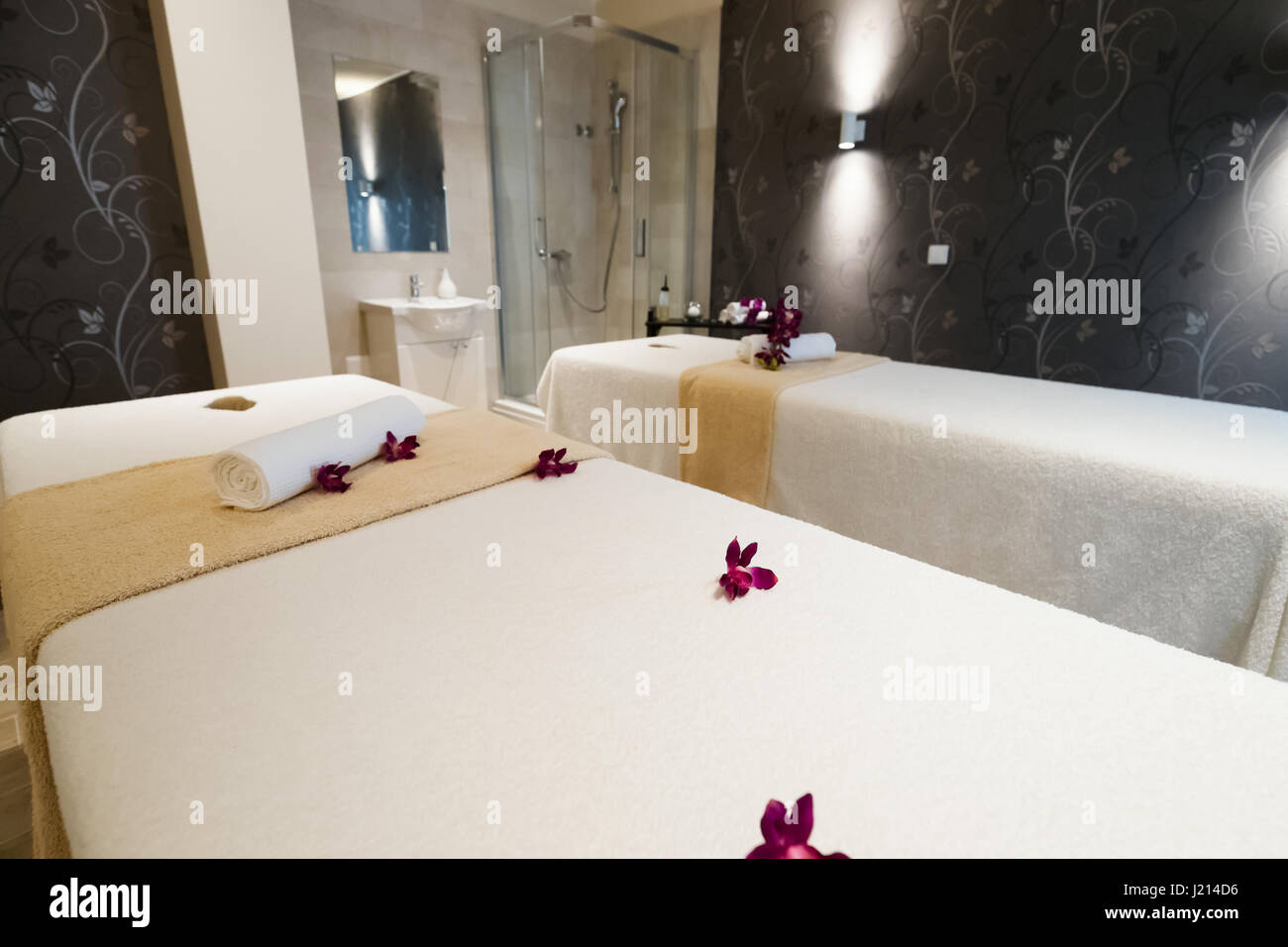 Beautiful massage beds in spa resort room Stock Photo - Alamy