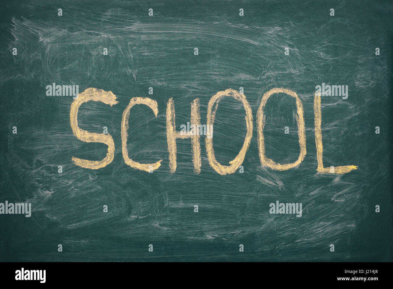 Word School on green chalkboard background. Close up Stock Photo - Alamy