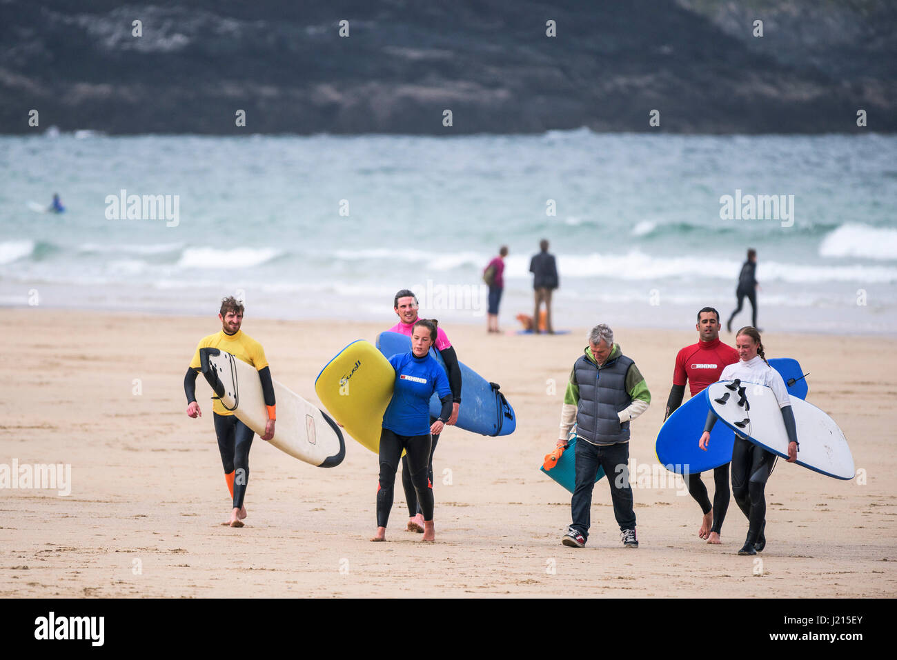 Surfing UK Fistral Newquay Seaside Surfers walking Carrying surfboards ...