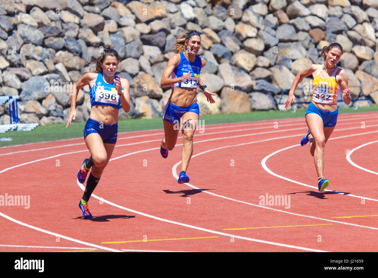 young girls doing Hurdling on a the track and field stadium CIAT in ...