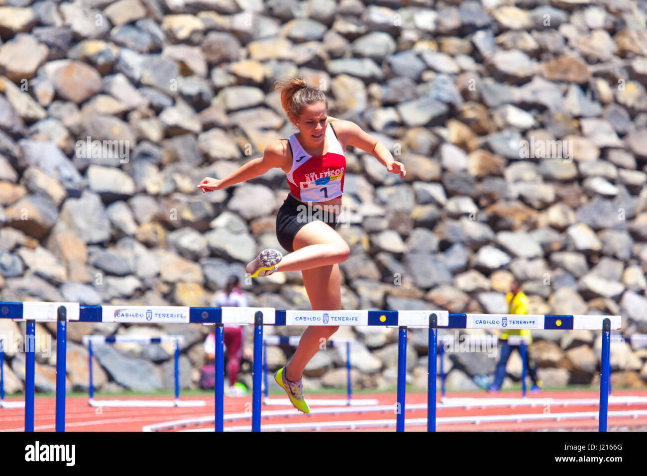 young girls doing Hurdling on a the track and field stadium CIAT in ...