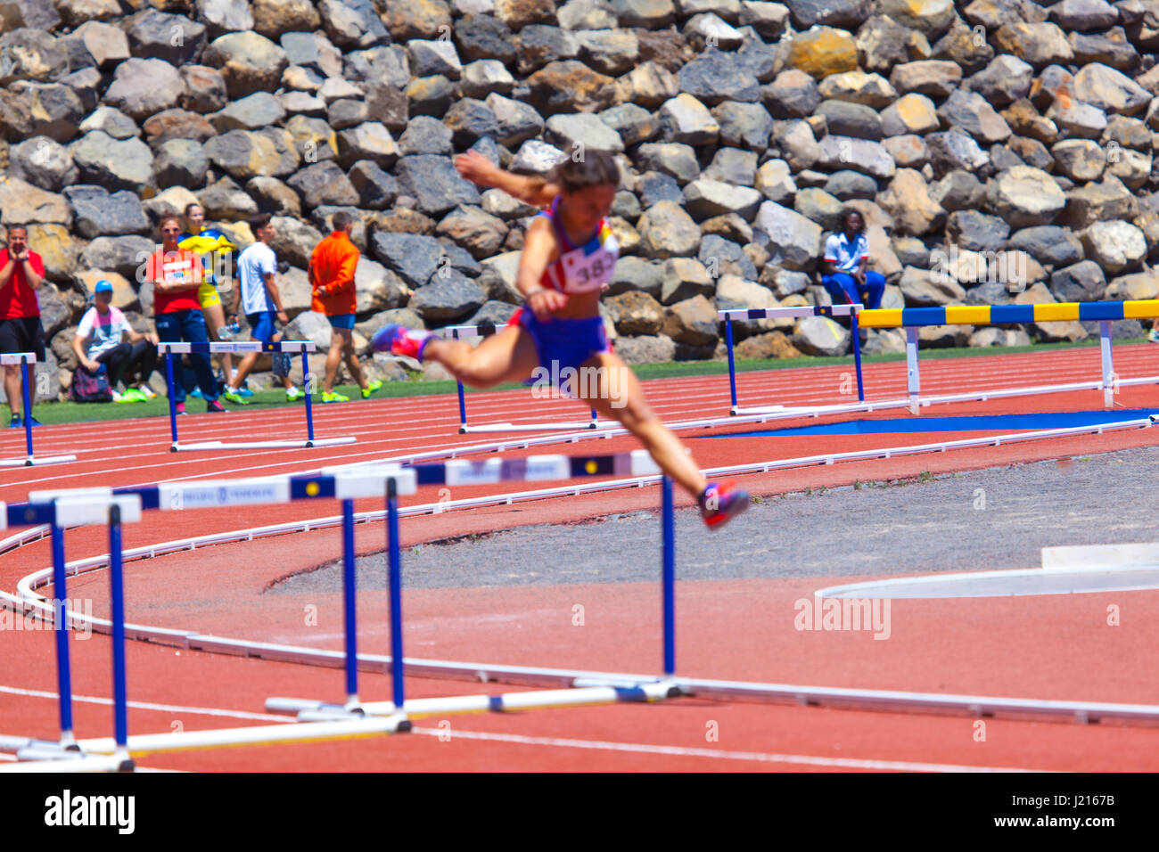young girls doing Hurdling on a the track and field stadium CIAT in ...