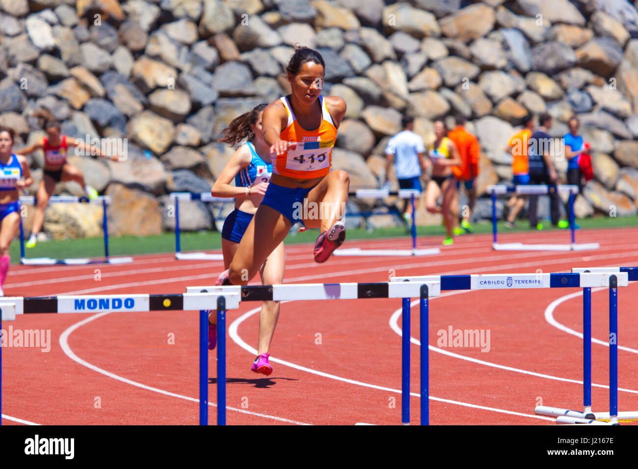 young girls doing Hurdling on a the track and field stadium CIAT in ...