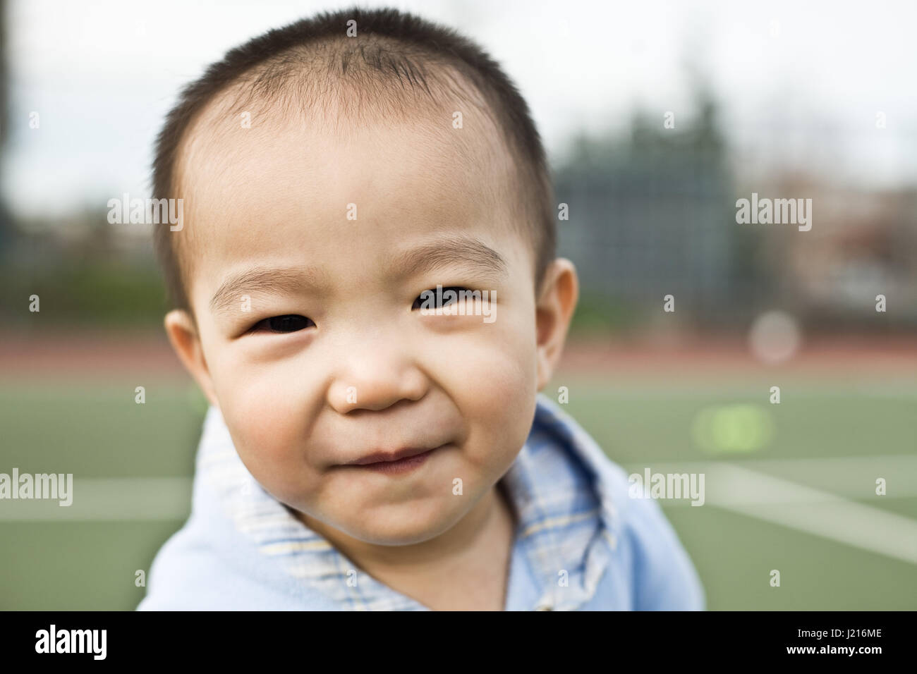 A shot of a happy asian boy smiling Stock Photo - Alamy