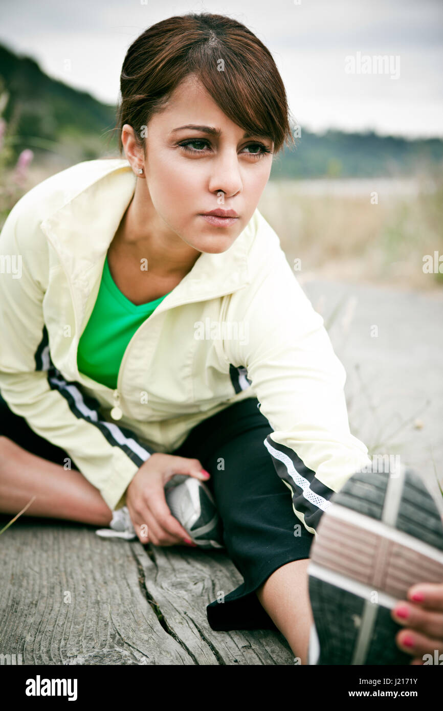 A beautiful asian woman exercises in a park Stock Photo - Alamy