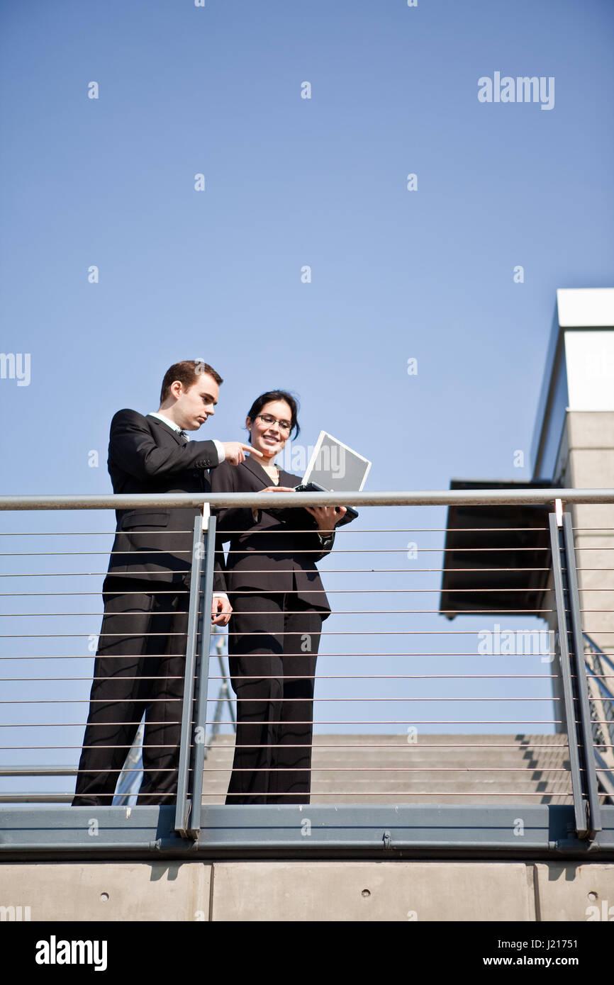 A shot of two business colleagues having a discussion outdoor Stock ...