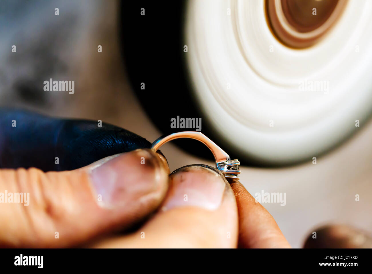 Jeweler polishing jewelry with tools Stock Photo - Alamy