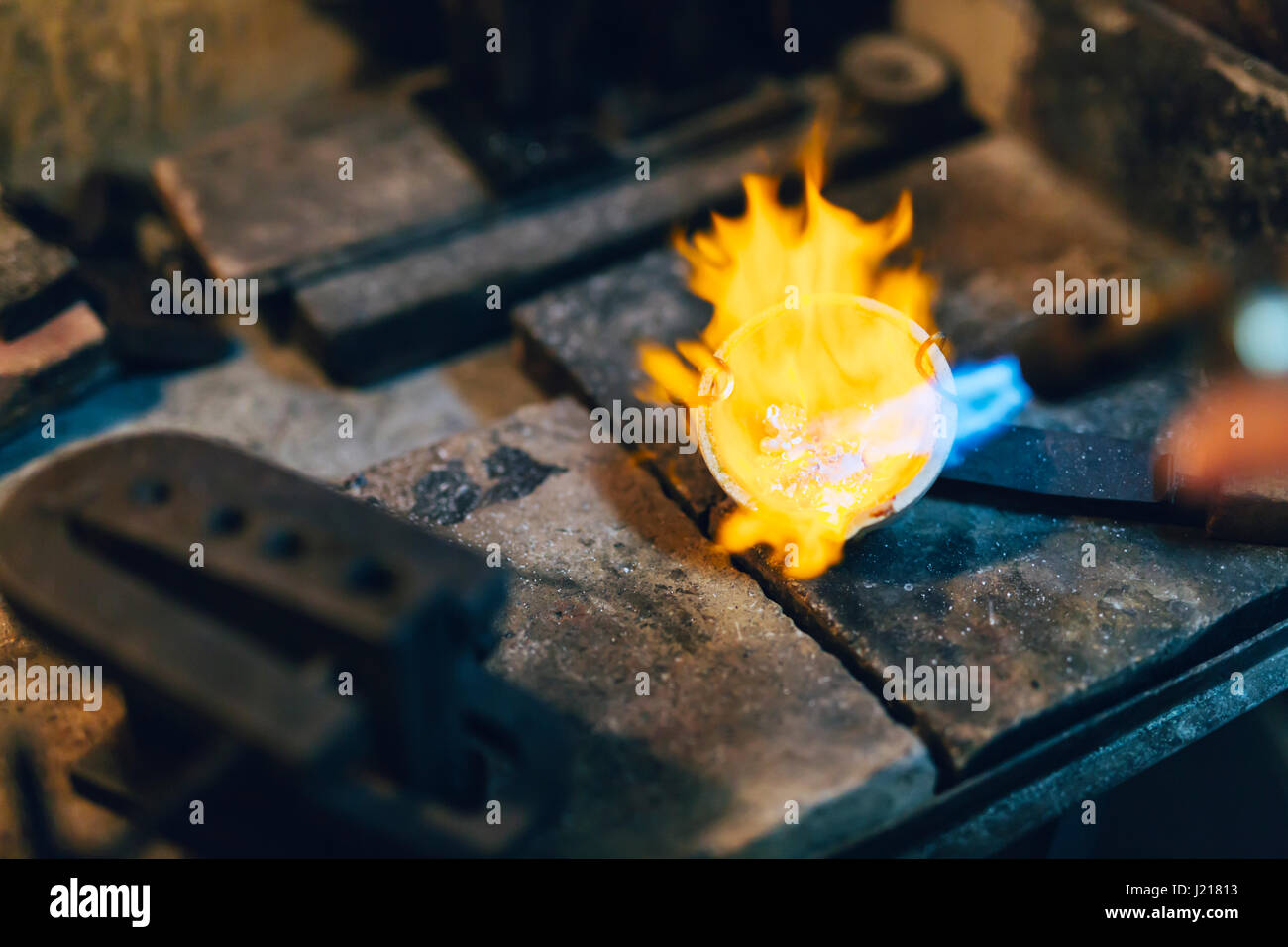 Jeweler welding gold the traditional way Stock Photo - Alamy
