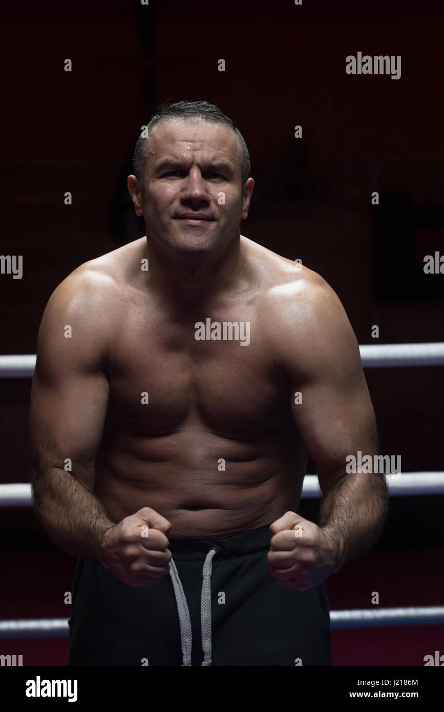 professional kickboxer with hands in martial arts position training for ...