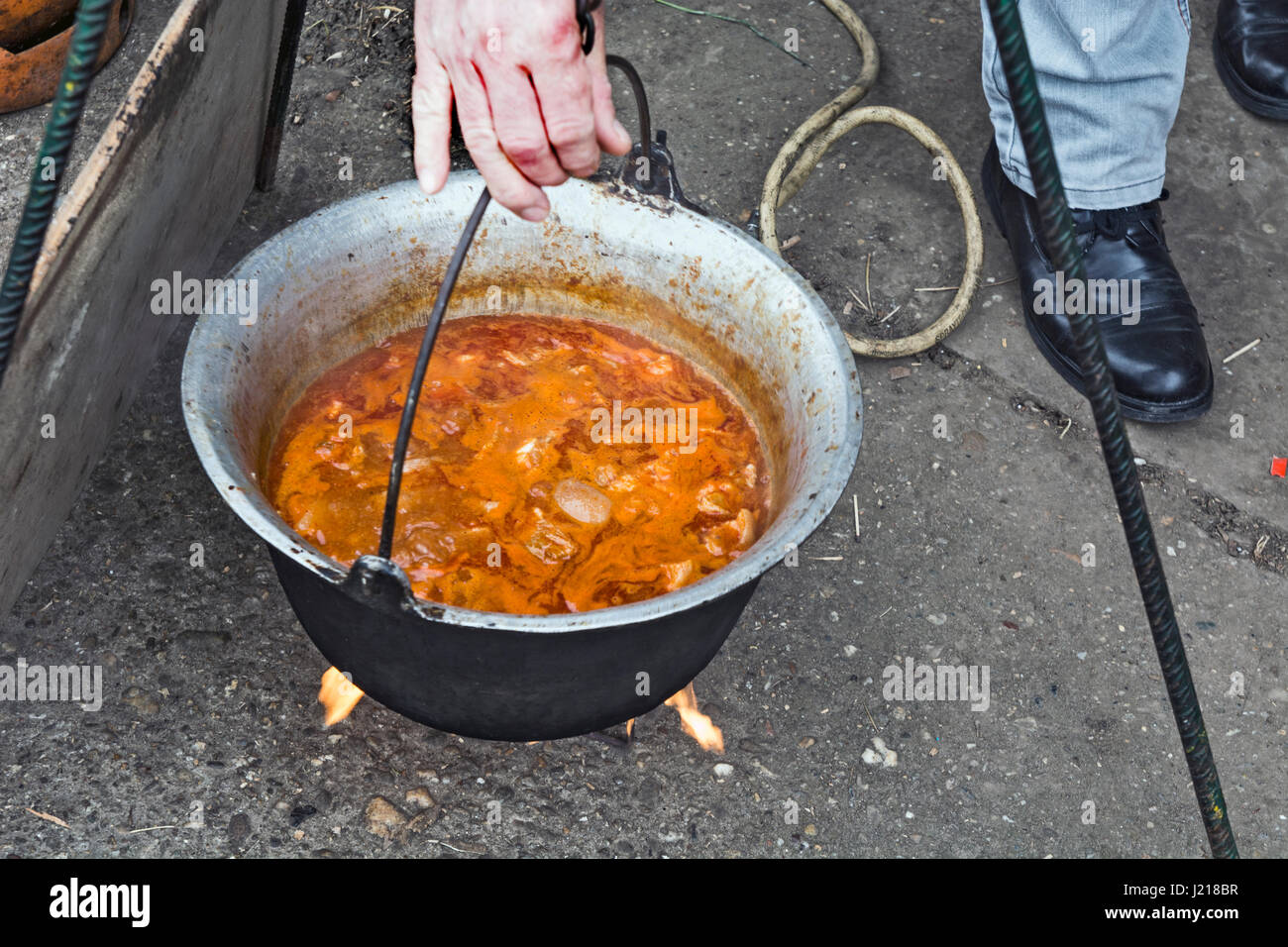 Cooking traditional stew in a kettle outdoors Stock Photo - Alamy