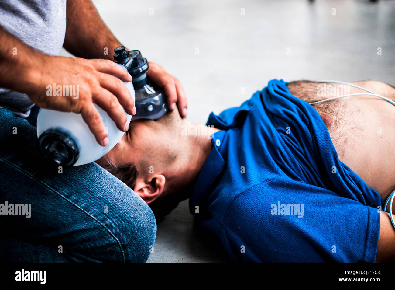 a girl helping a guy after heart attack with cardiopulmonary ...